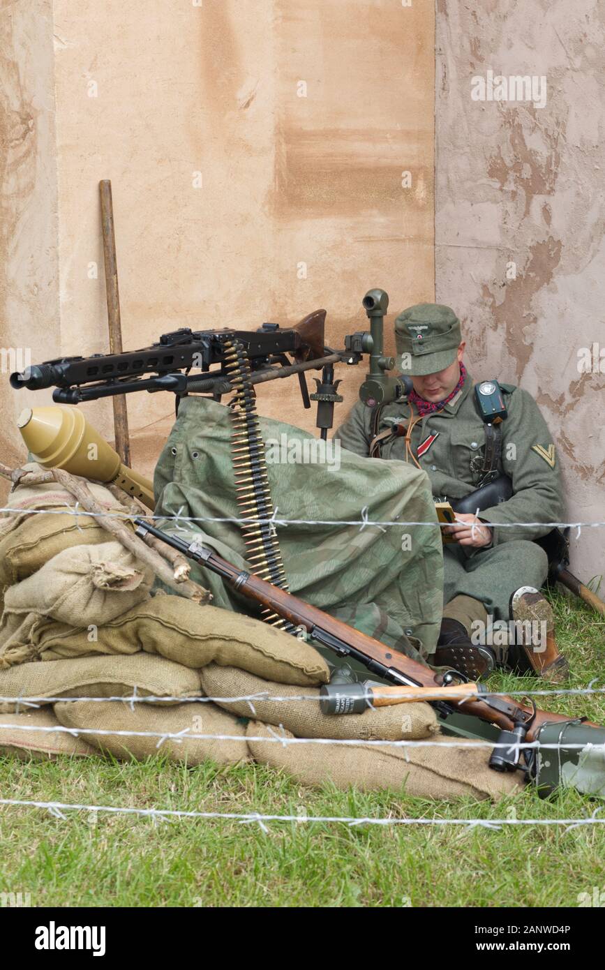 Behind enemy lines, German soldier with machine gun Stock Photo - Alamy