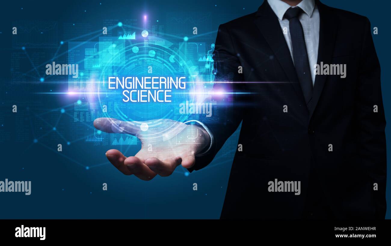 Man hand holding ENGINEERING SCIENCE inscription, technology concept ...