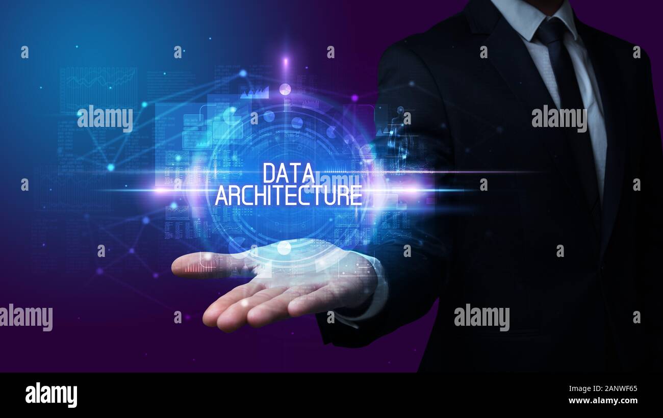 Man hand holding DATA ARCHITECTURE inscription, technology concept ...