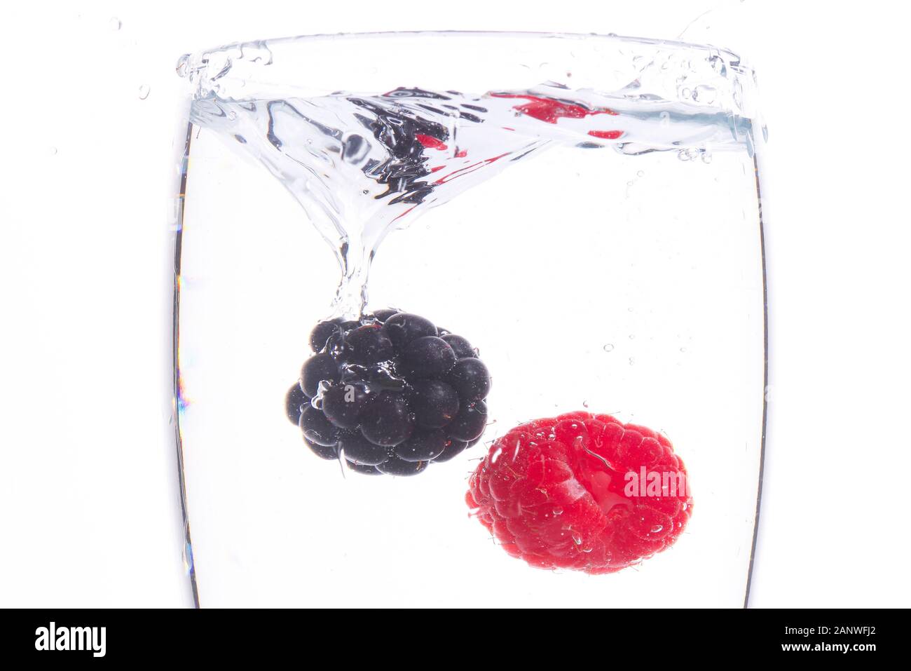 Blackberry and raspberry splashing into water Stock Photo - Alamy