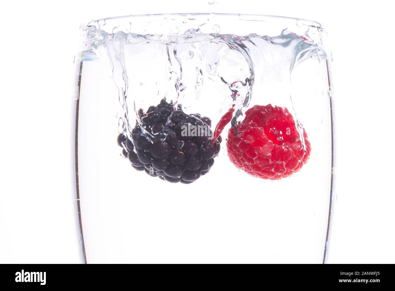 Blackberry and raspberry splashing into water Stock Photo - Alamy
