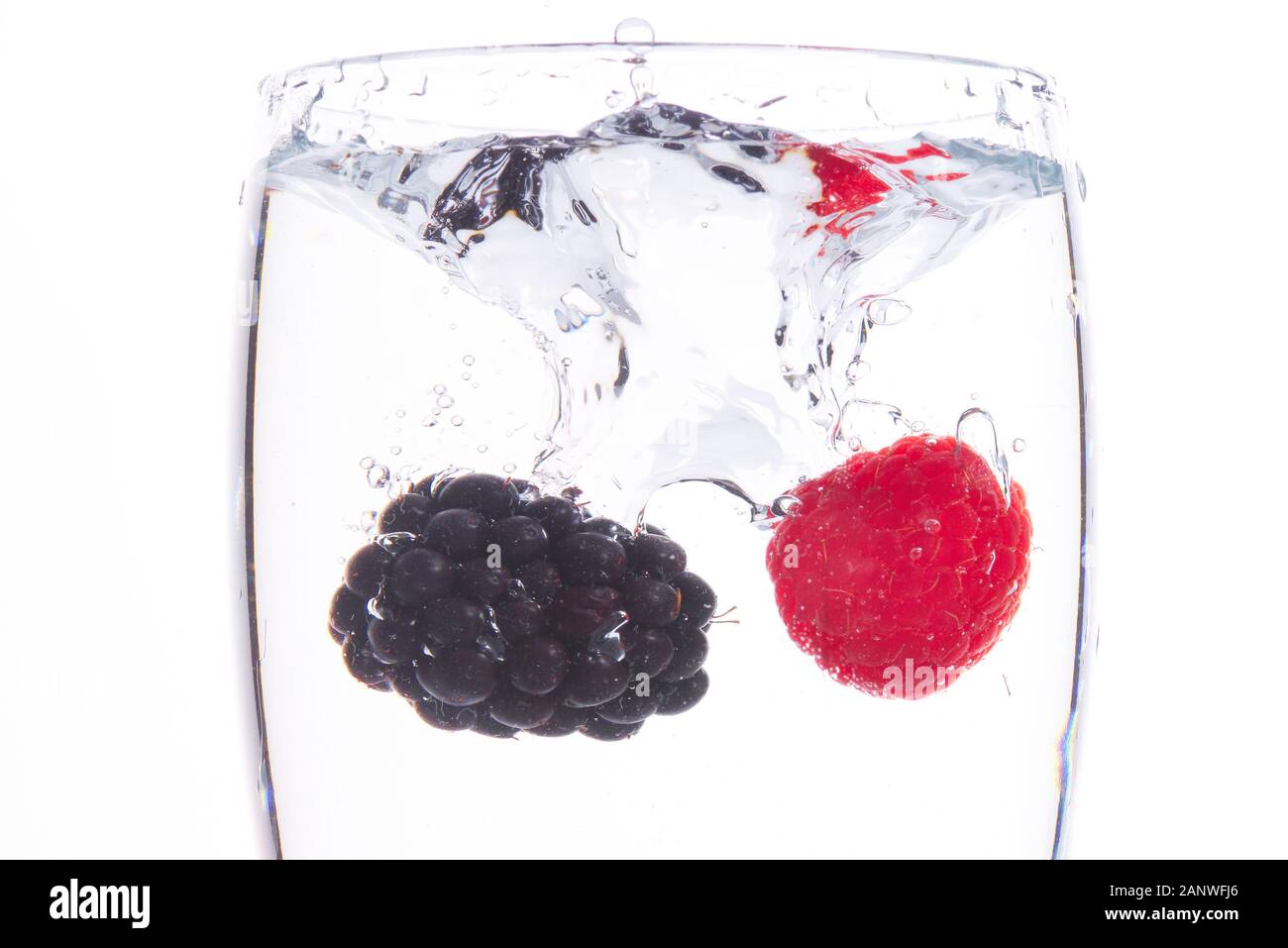 Blackberry and raspberry splashing into water Stock Photo - Alamy