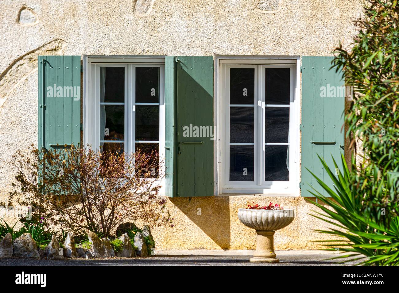 Rustic windows house in southern France Stock Photo - Alamy