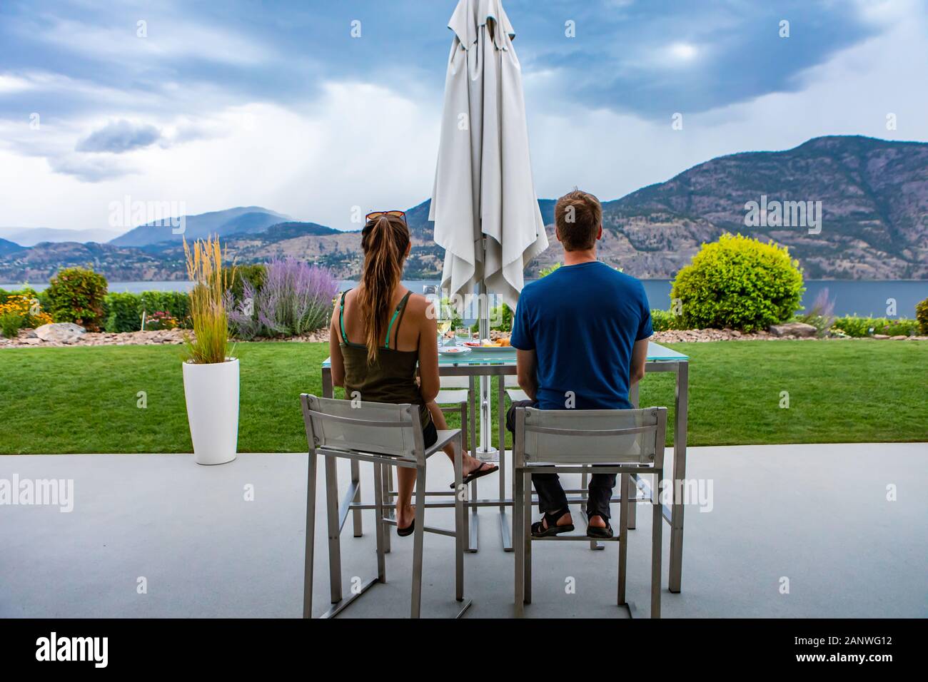 caucasian young man and woman couple back rear view as they tasting ...