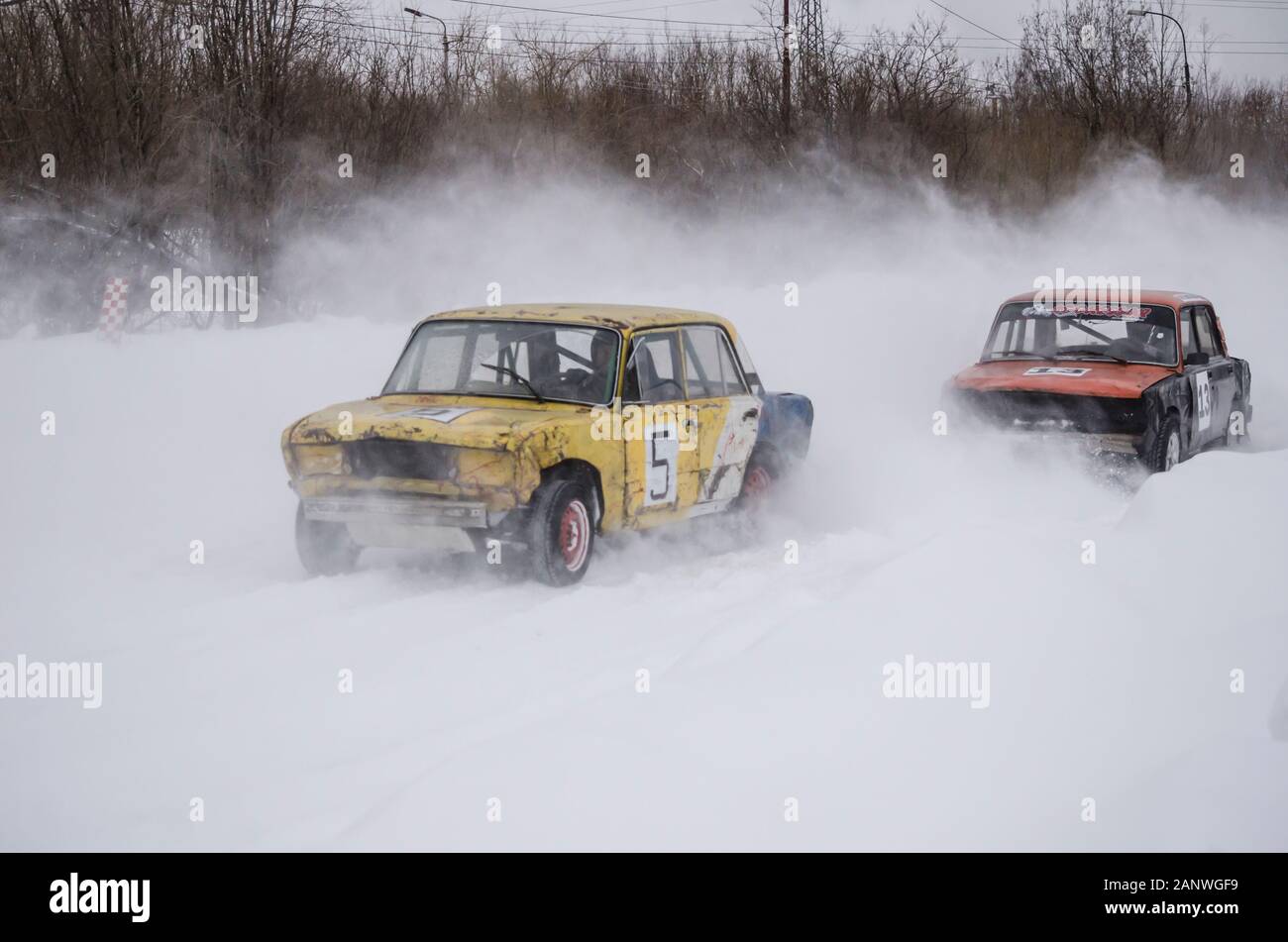 Winter racing on the ice track. Russian racing car company Lada Stock ...