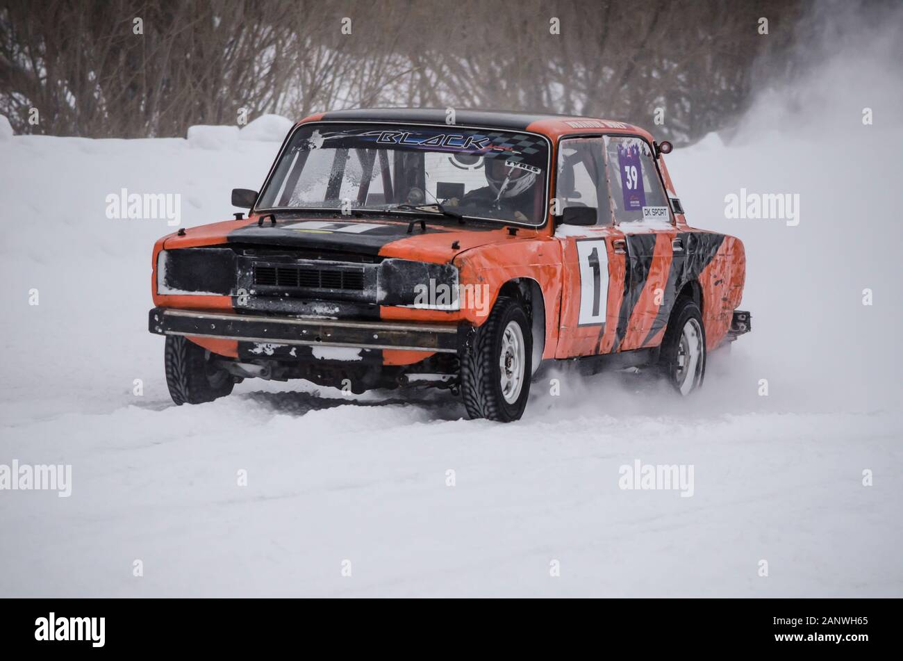 Winter racing on the ice track. Russian racing car company Lada Stock ...
