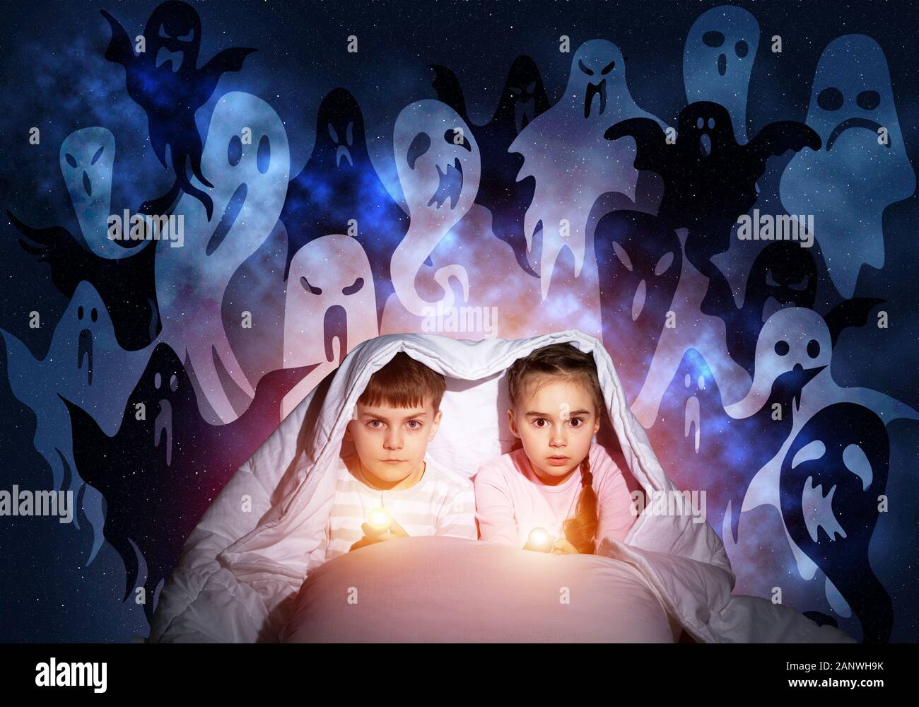 Scared sister and brother with flashlights Stock Photo - Alamy