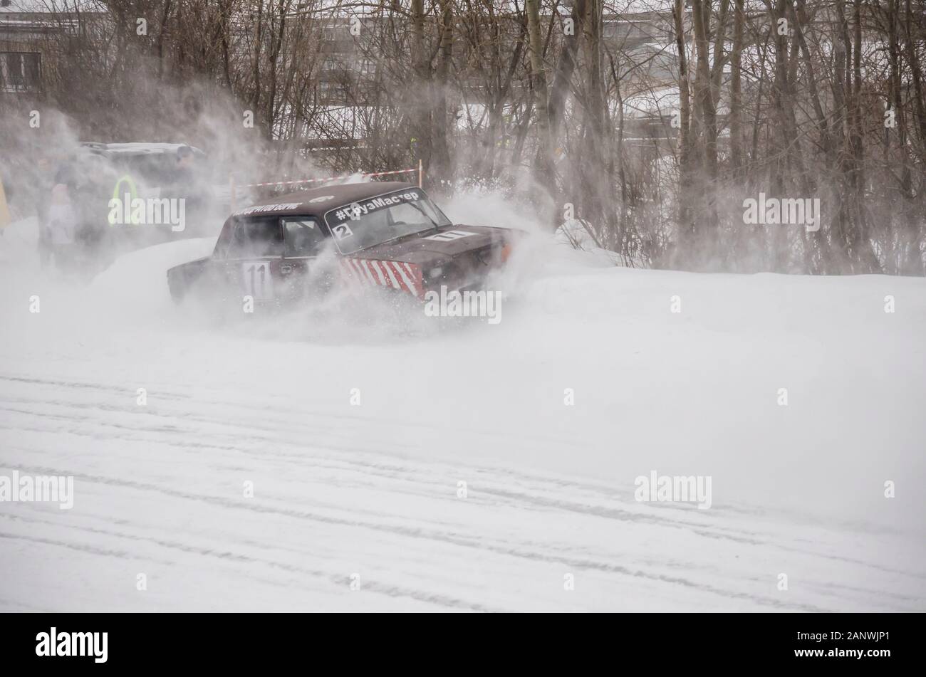 Winter racing on the ice track. Russian racing car company Lada Stock ...