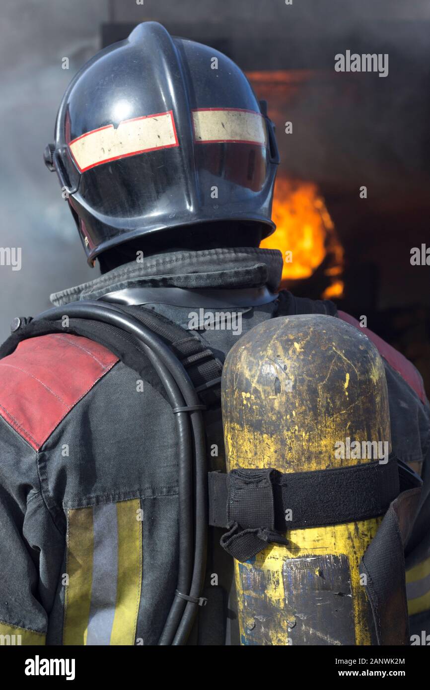 Firefighter putting out fire training station extinguisher backdraft ...