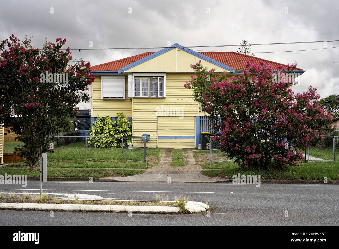 High set weatherboard Post War suburban house, enclosed garage ...