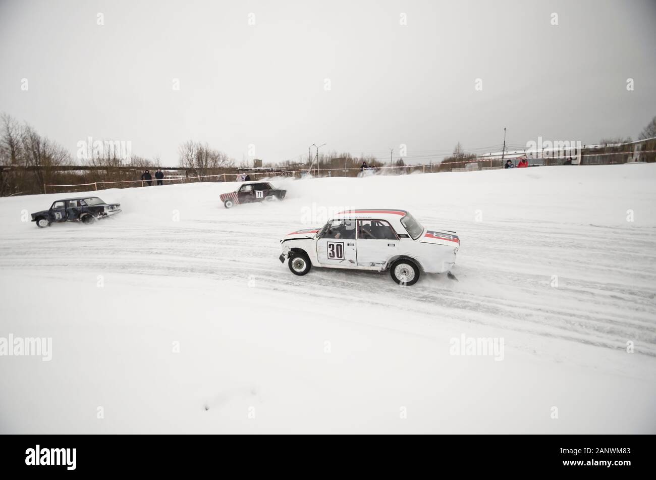 Winter racing on the ice track. Russian racing car company Lada Stock ...