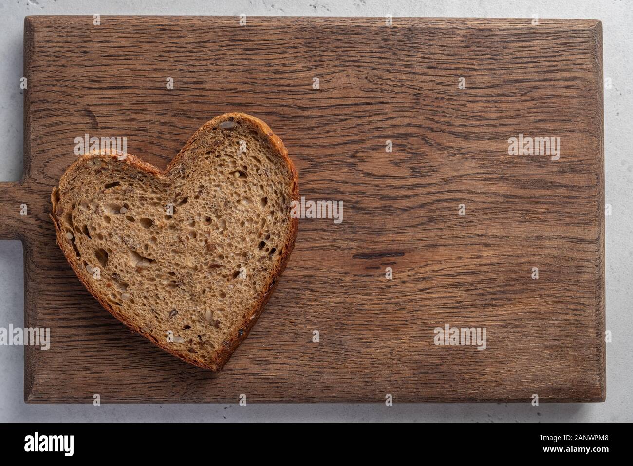 heart shaped slice of healthy brown bread Stock Photo - Alamy