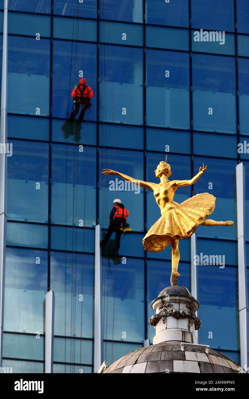 Statue of Russian ballerina Anna Pavlova on top of the dome of Victoria Palace Theatre and ...