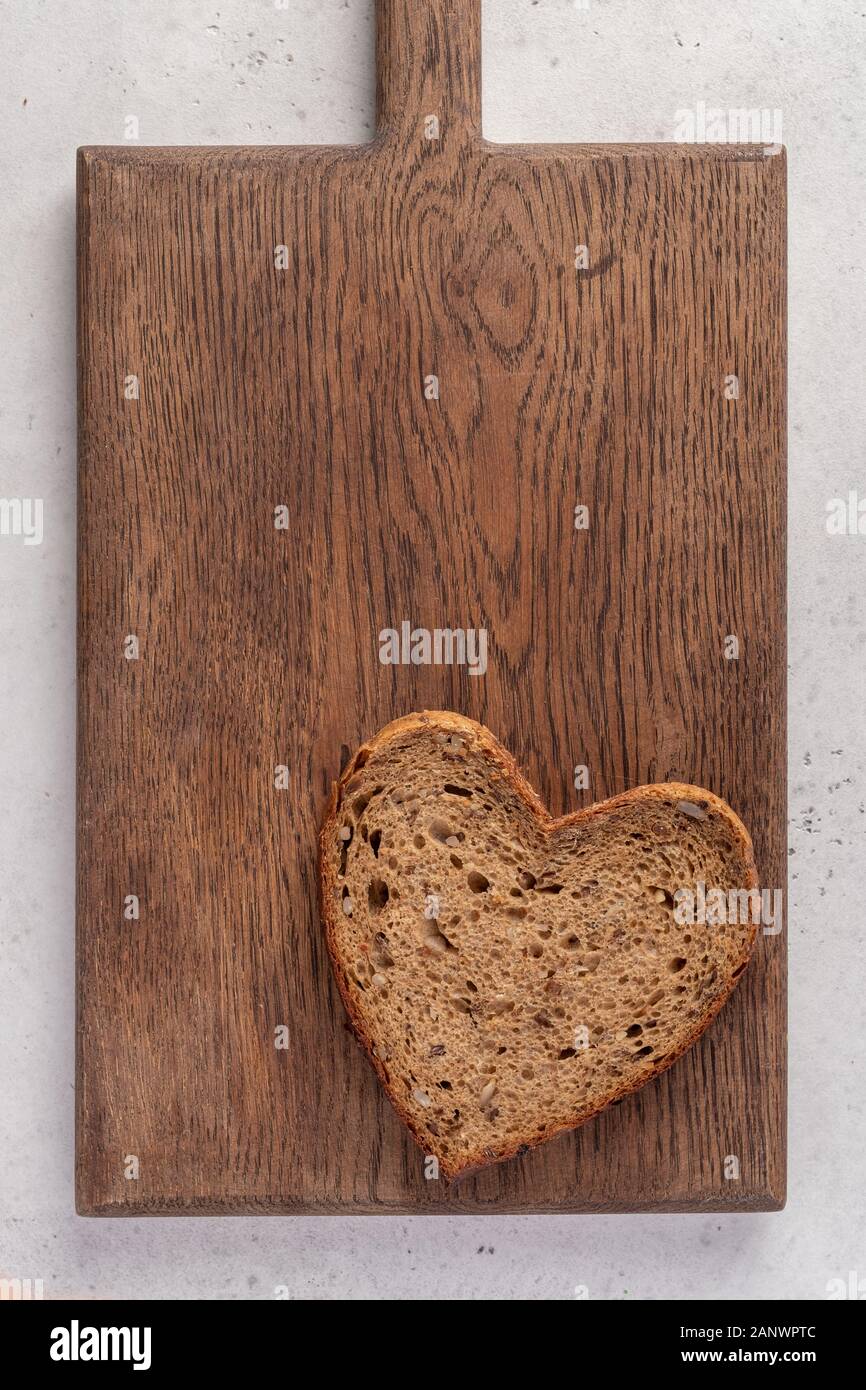 heart shaped slice of healthy brown bread Stock Photo - Alamy