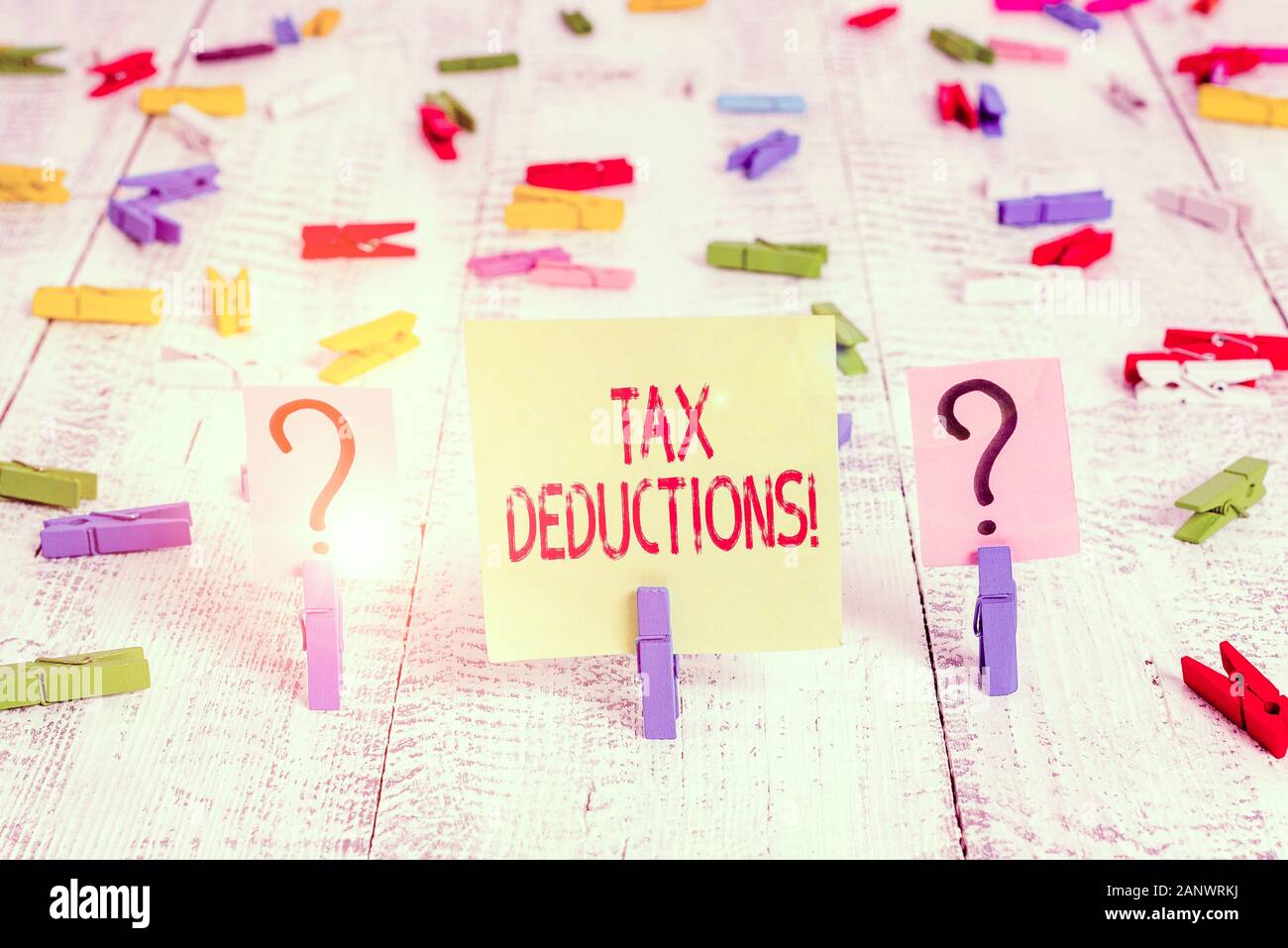 Writing note showing Tax Deductions. Business concept for reduction ...