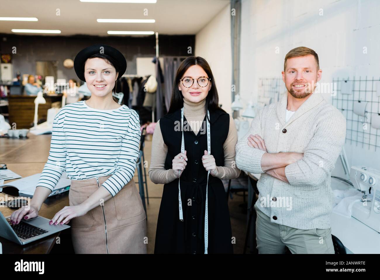 Colleagues in tailoring studio Stock Photo - Alamy