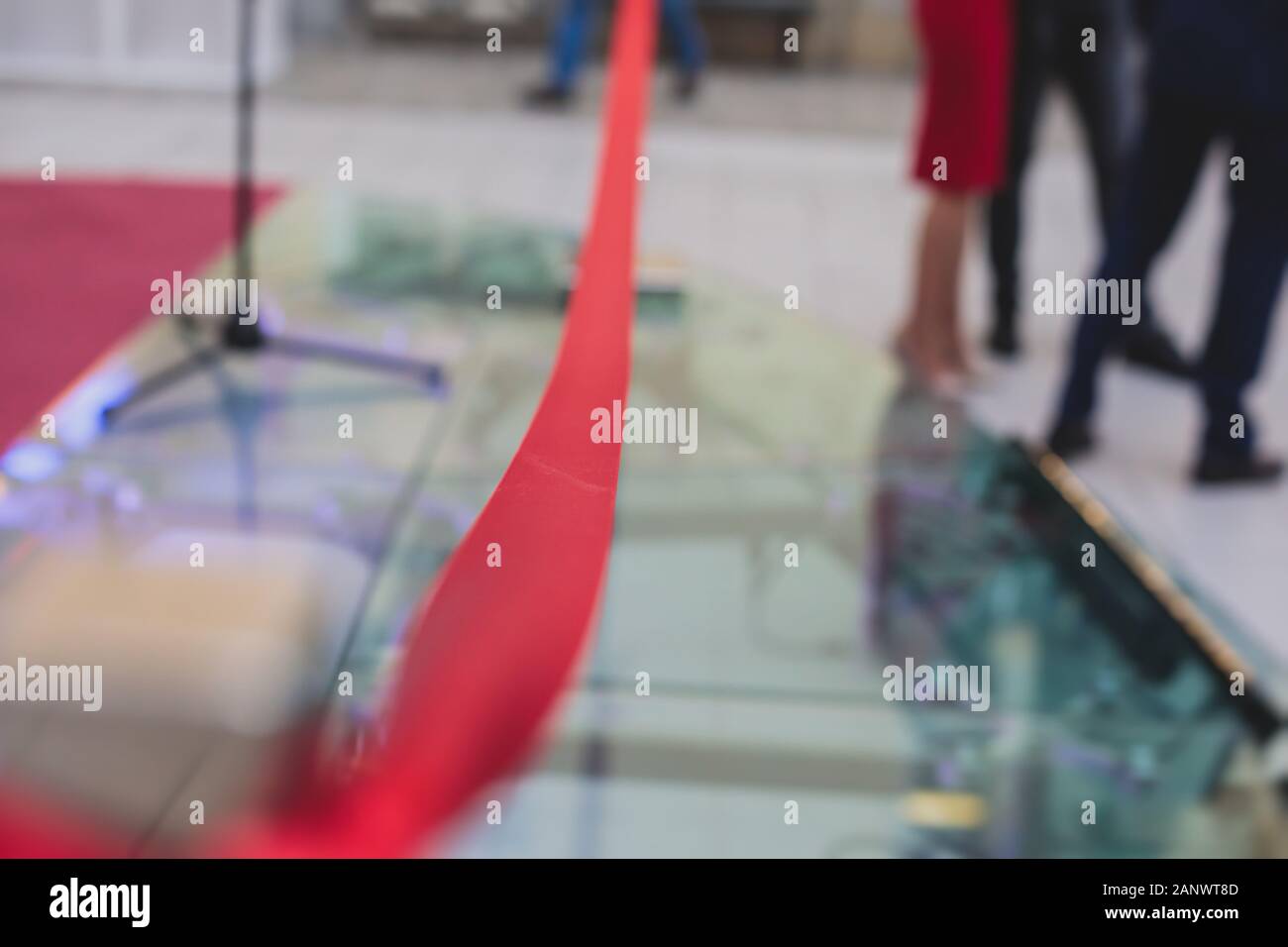 Process of cutting the red ribbon during the grand opening of the new ...