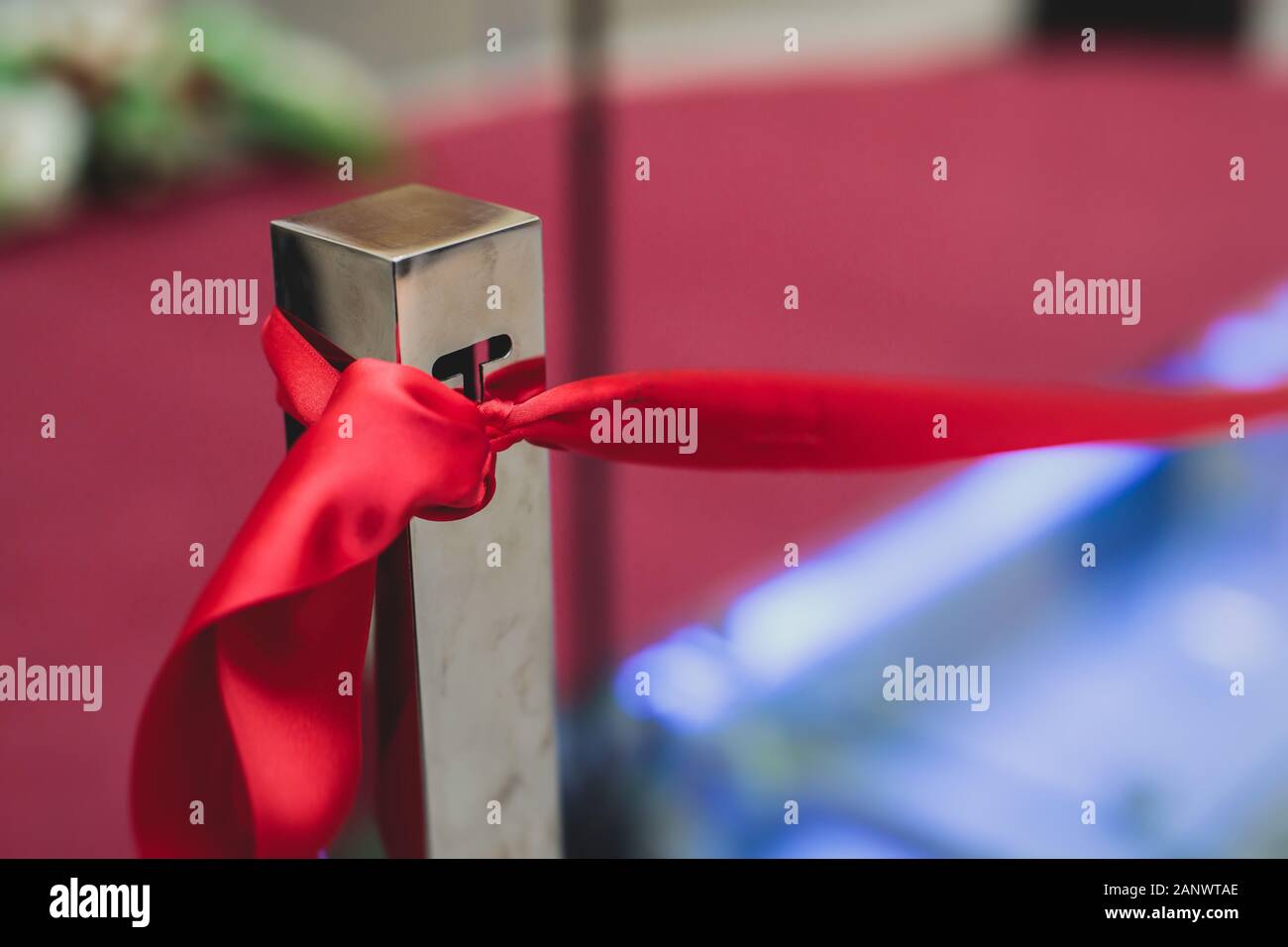 Process of cutting the red ribbon during the grand opening of the new ...