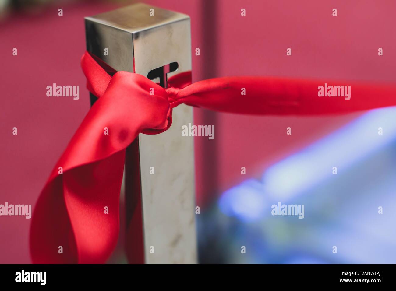 Process of cutting the red ribbon during the grand opening of the new ...
