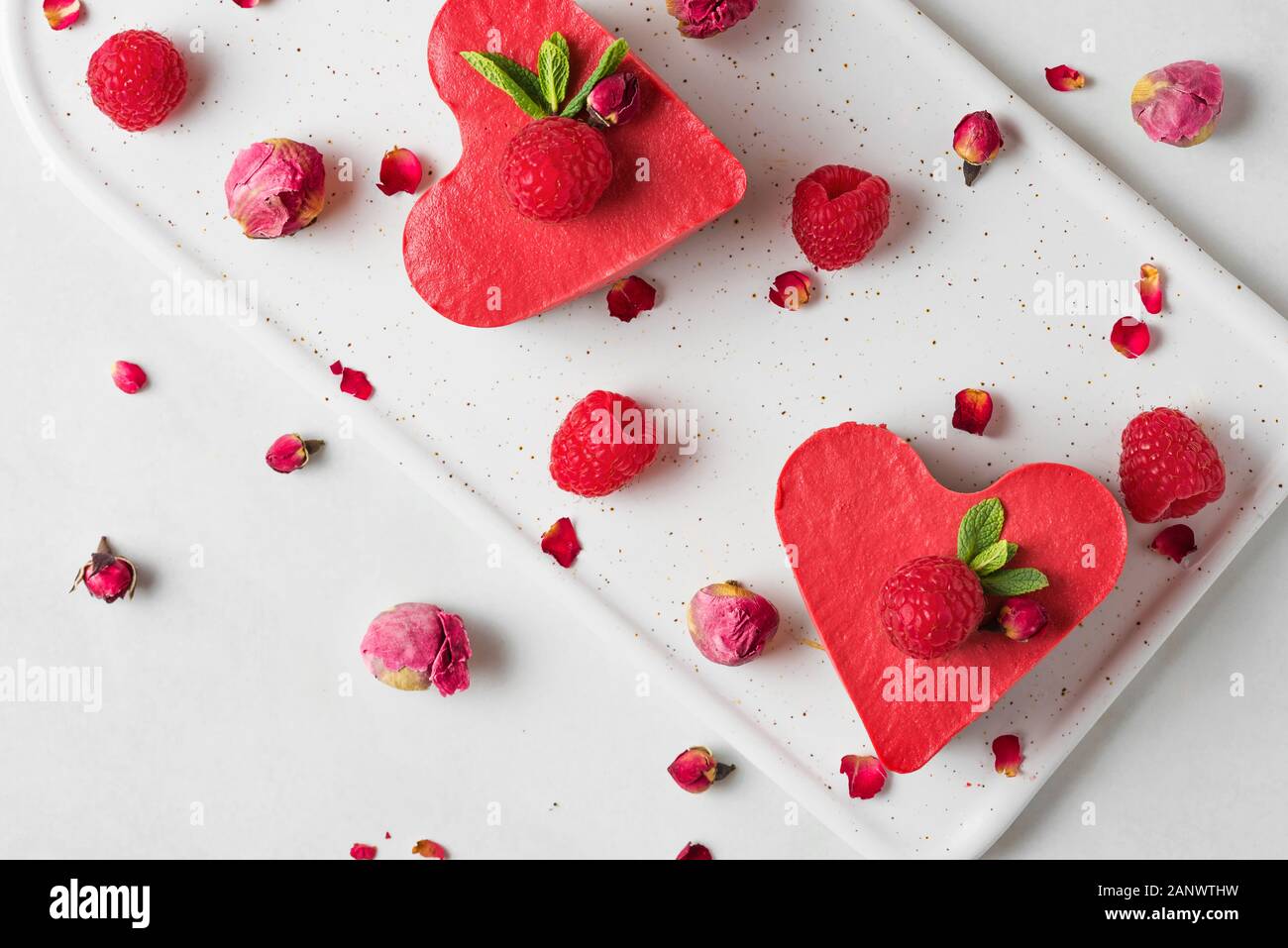 Valentines day dessert. heart shaped raw vegan red cakes with ...