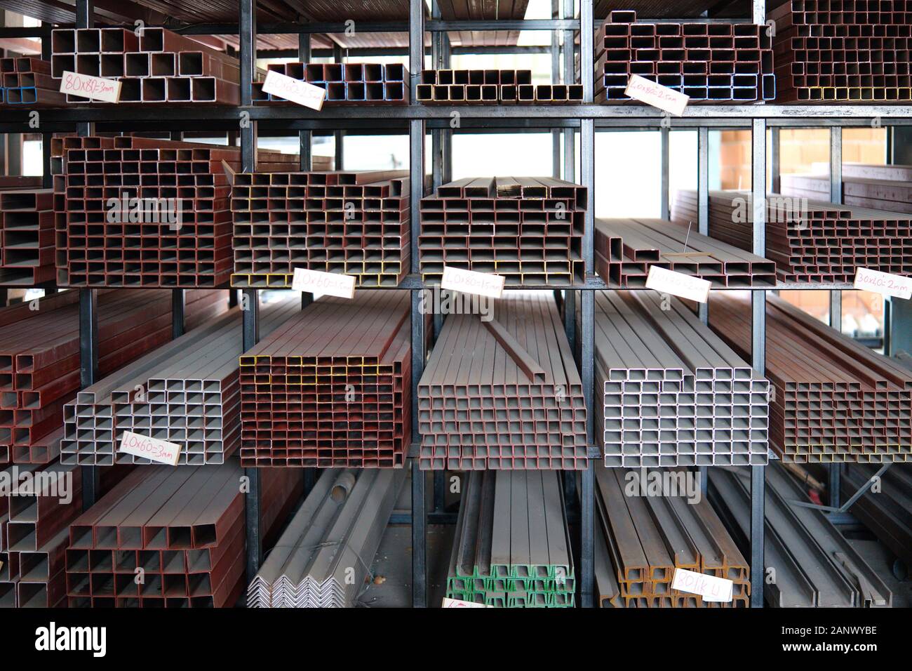 square section iron, steel profile stack background Stock Photo - Alamy