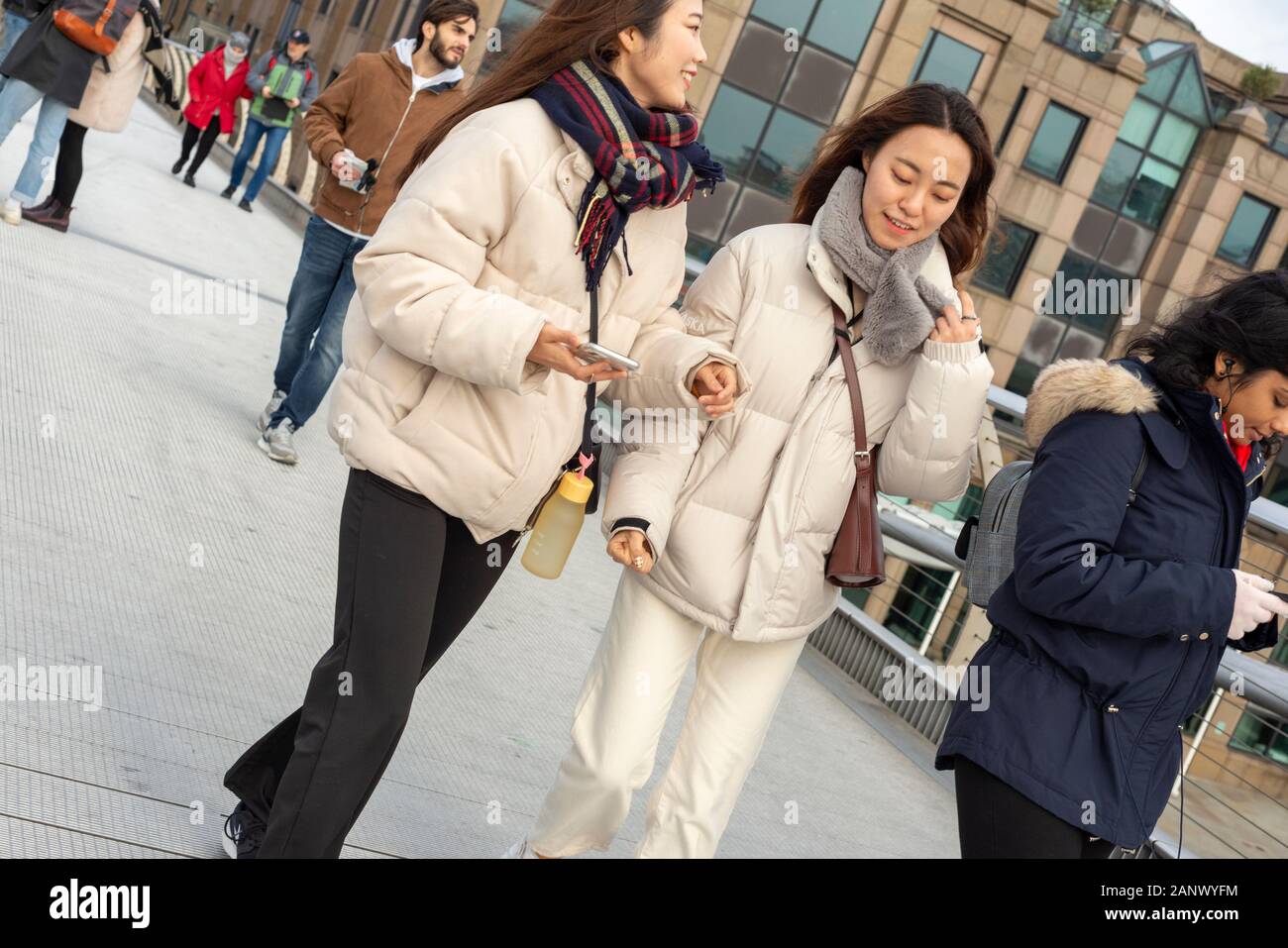 Happy smiling multicultural tourists people visitors walking on the ...