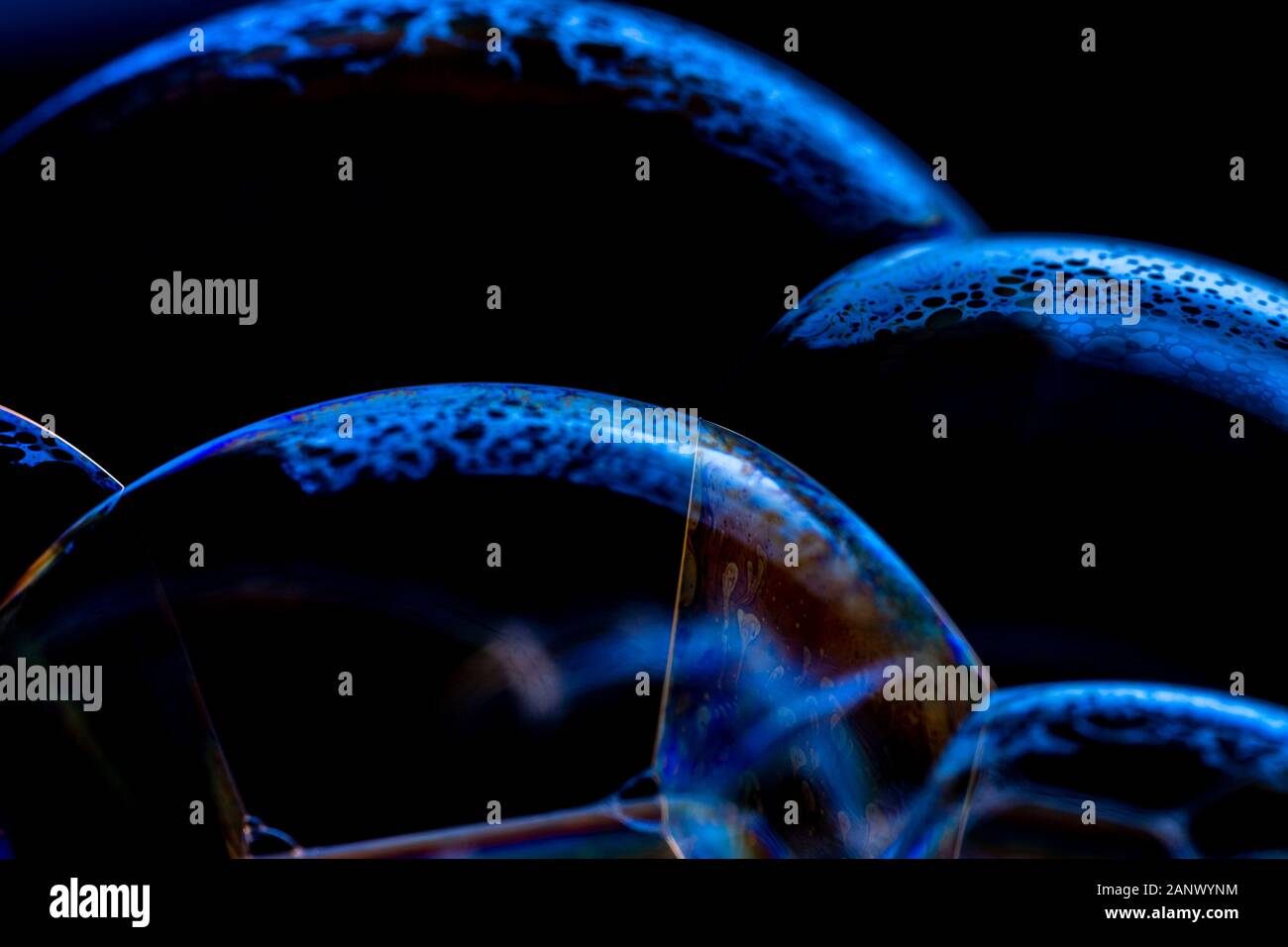 Creative abstract background made of chain of bubbles structure in dark ...