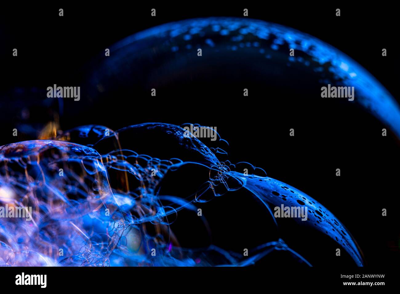 Creative abstract background made of chain of bubbles structure in dark ...