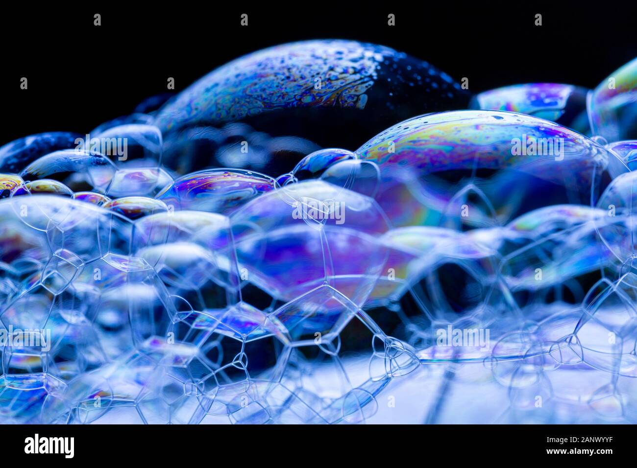 Creative abstract background made of chain of bubbles structure in dark ...