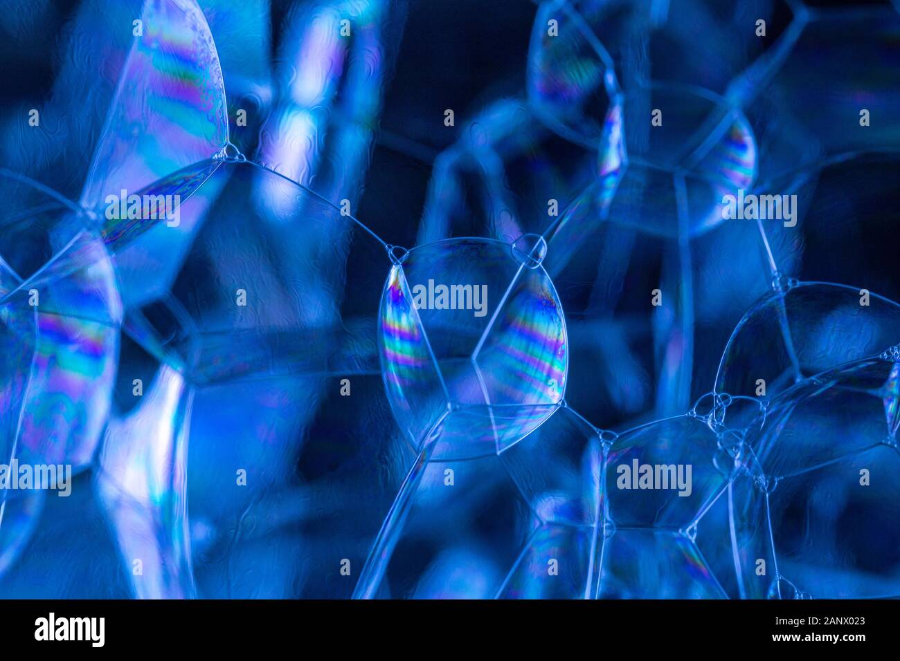 Creative abstract background made of chain of bubbles structure in dark ...