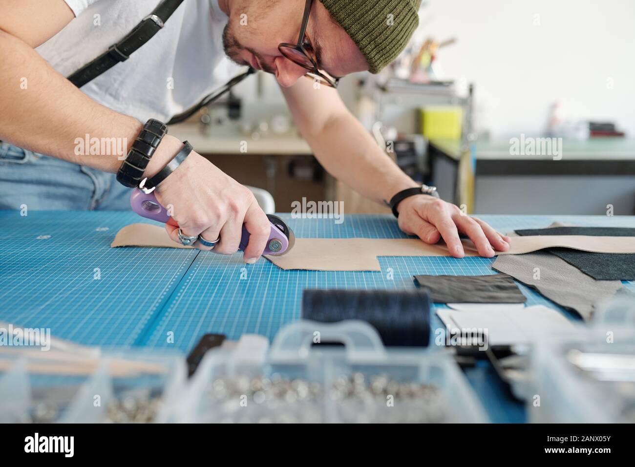 Using cutting wheel for processing leather Stock Photo - Alamy
