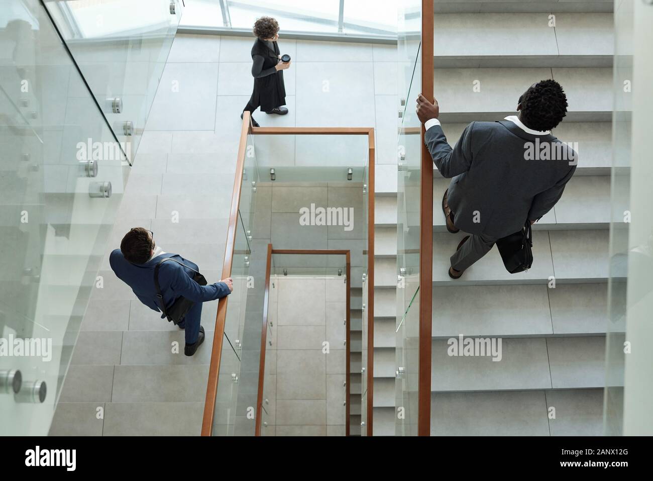 Business person and walking downstairs hi-res stock photography and ...