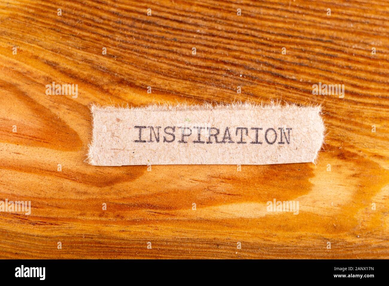 The word "inspiration" typed. The inscription on a gray sheet of ...