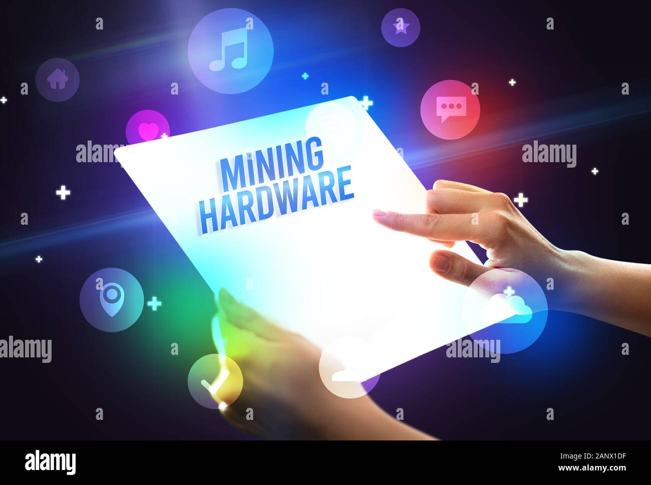 Holding futuristic tablet with MINING HARDWARE inscription, new ...