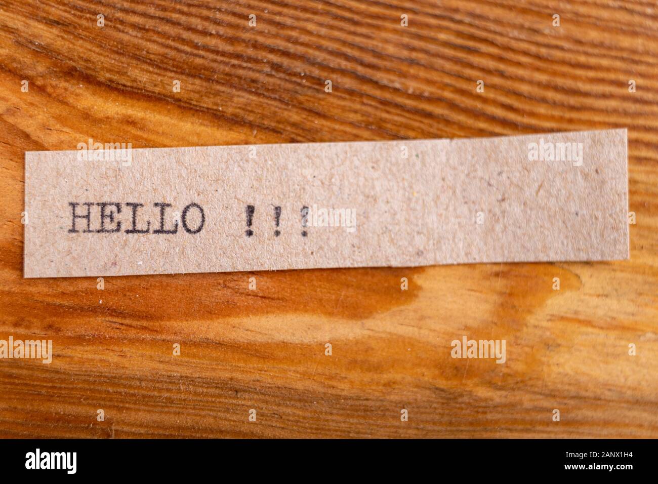 The word "hello" typed. The inscription on a gray sheet of pappier ...