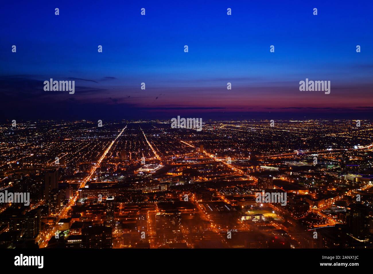 Suburban view of Chicago city at night from above with small houses and ...