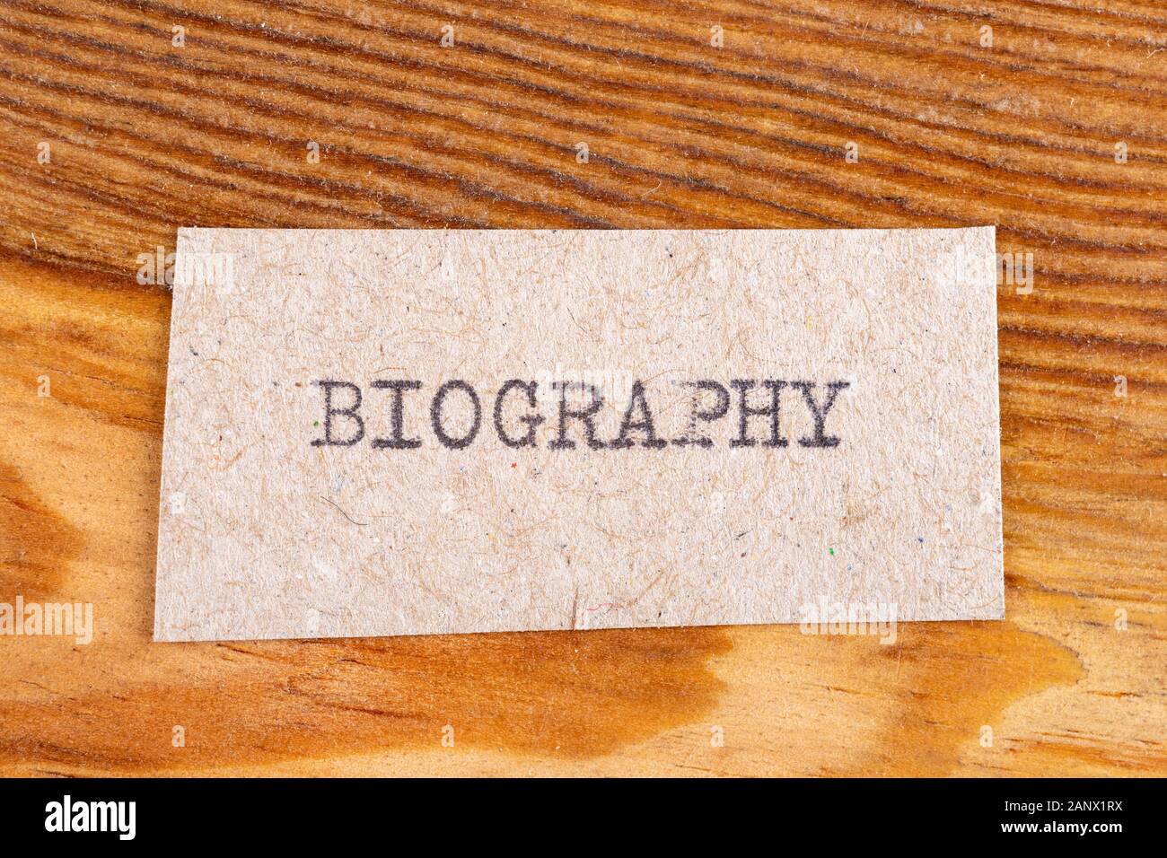 The word "biography" typed. The inscription on a gray sheet of pappier ...