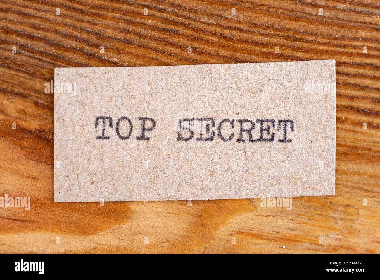 The word "top secret" typed. The inscription on a gray sheet of pappier ...