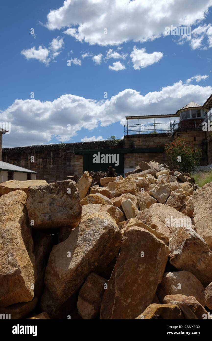 Broken sandstone rocks, guard tower on perimeter wall, Parramatta Gaol ...