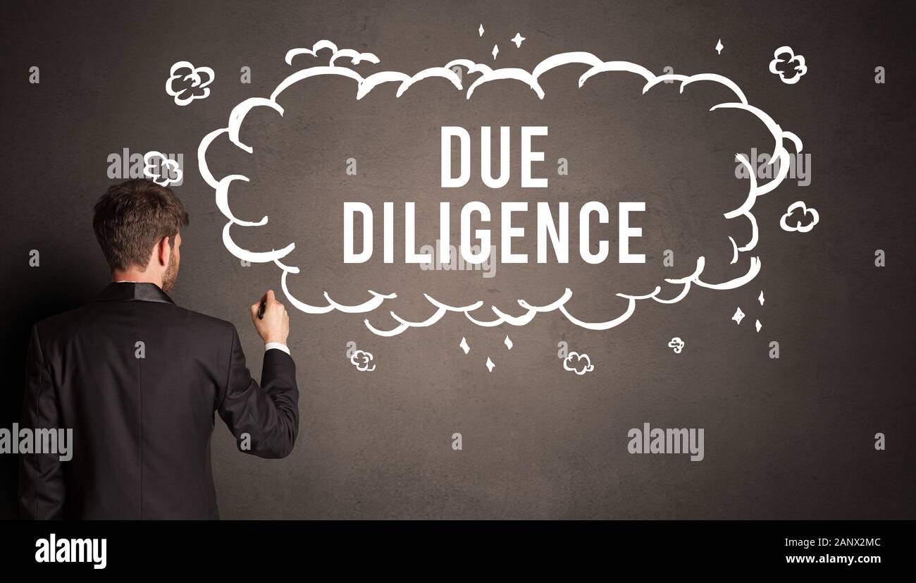 businessman drawing a cloud with DUE DILIGENCE inscription inside ...