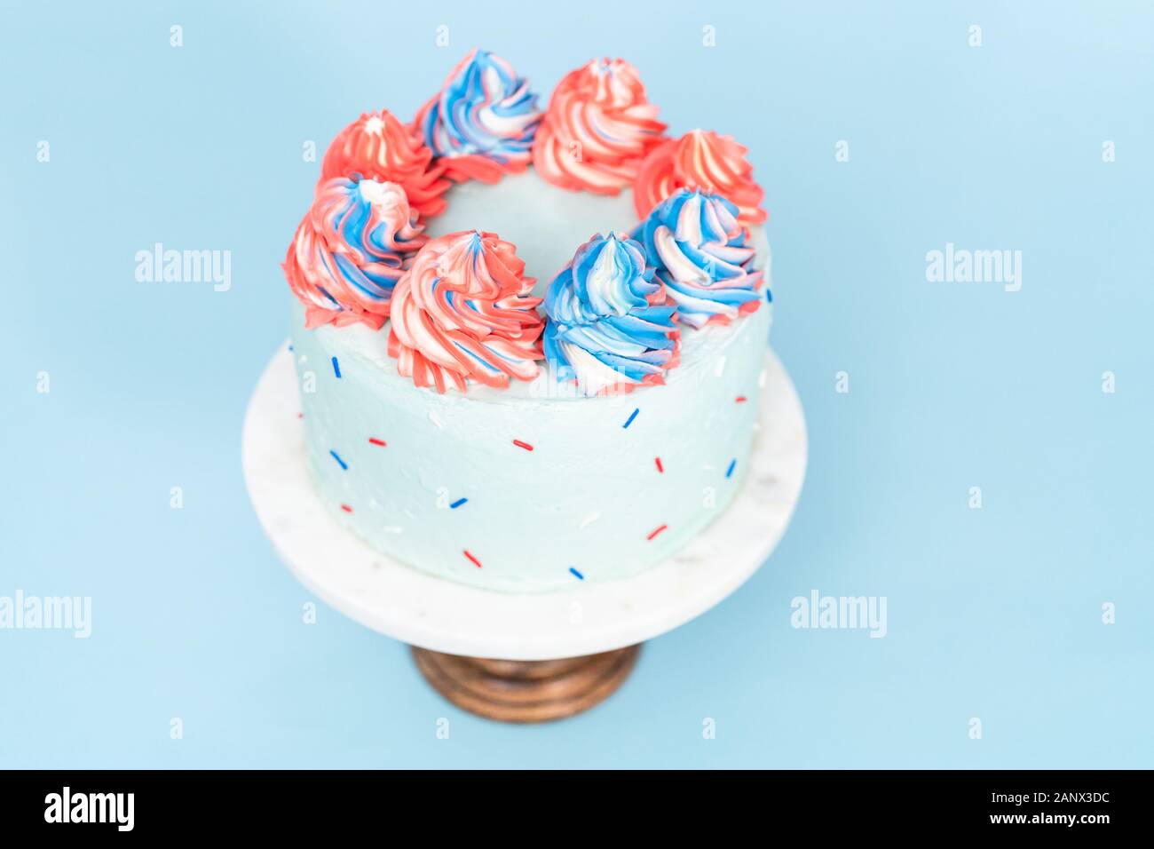 Red, white, and blue round cake frosted with buttercream frosting Stock ...