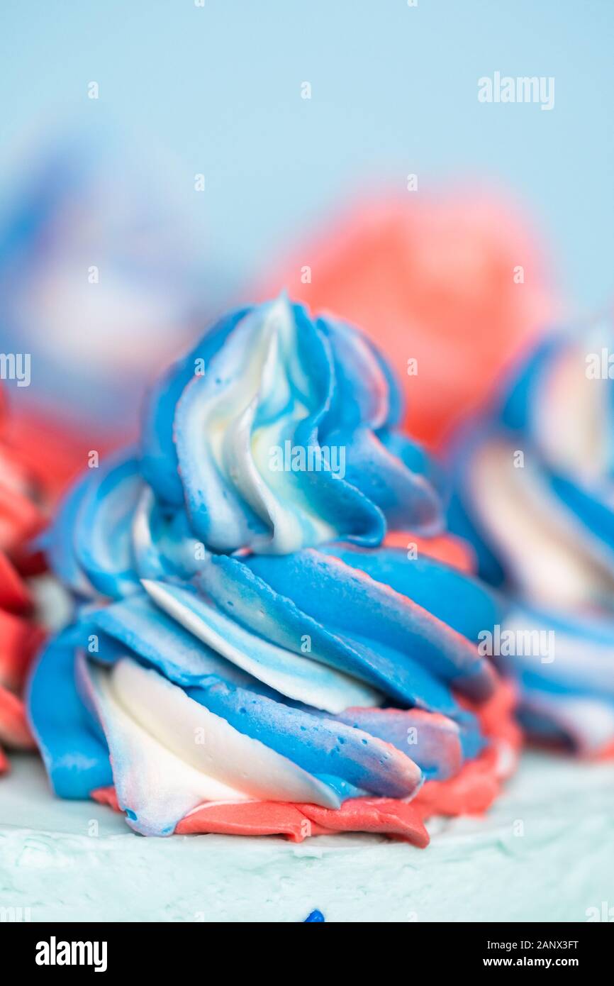 Red, white, and blue round cake frosted with buttercream frosting Stock ...