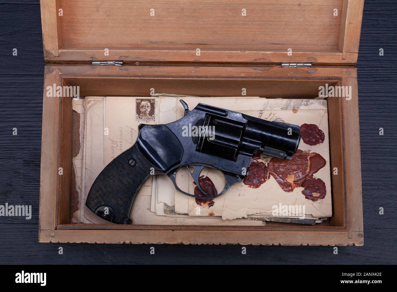Memorabilia - old retro vintage revolver gun with ammunitions in wooden ...