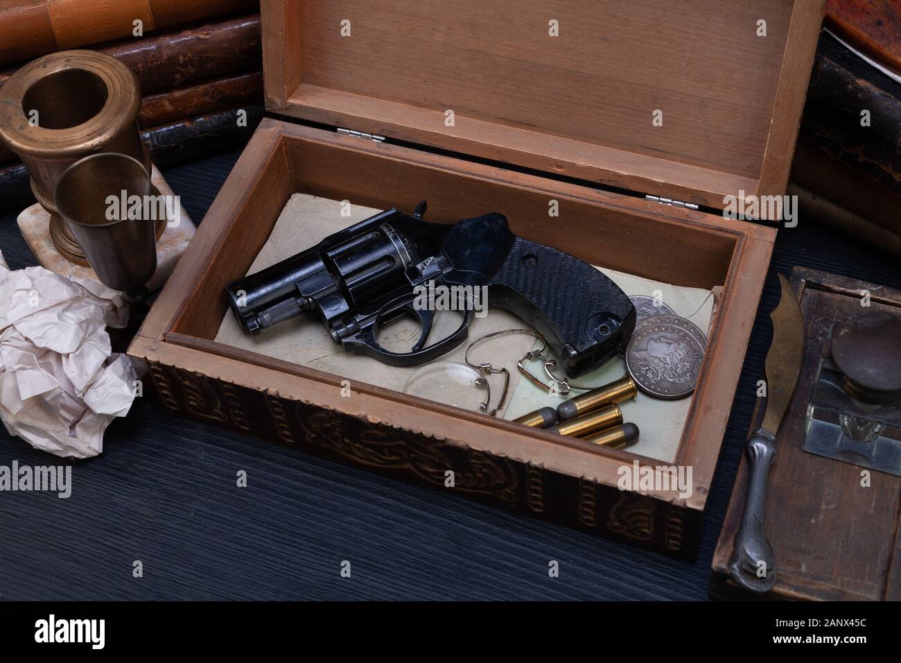 Memorabilia - old retro vintage revolver gun with ammunitions in wooden ...