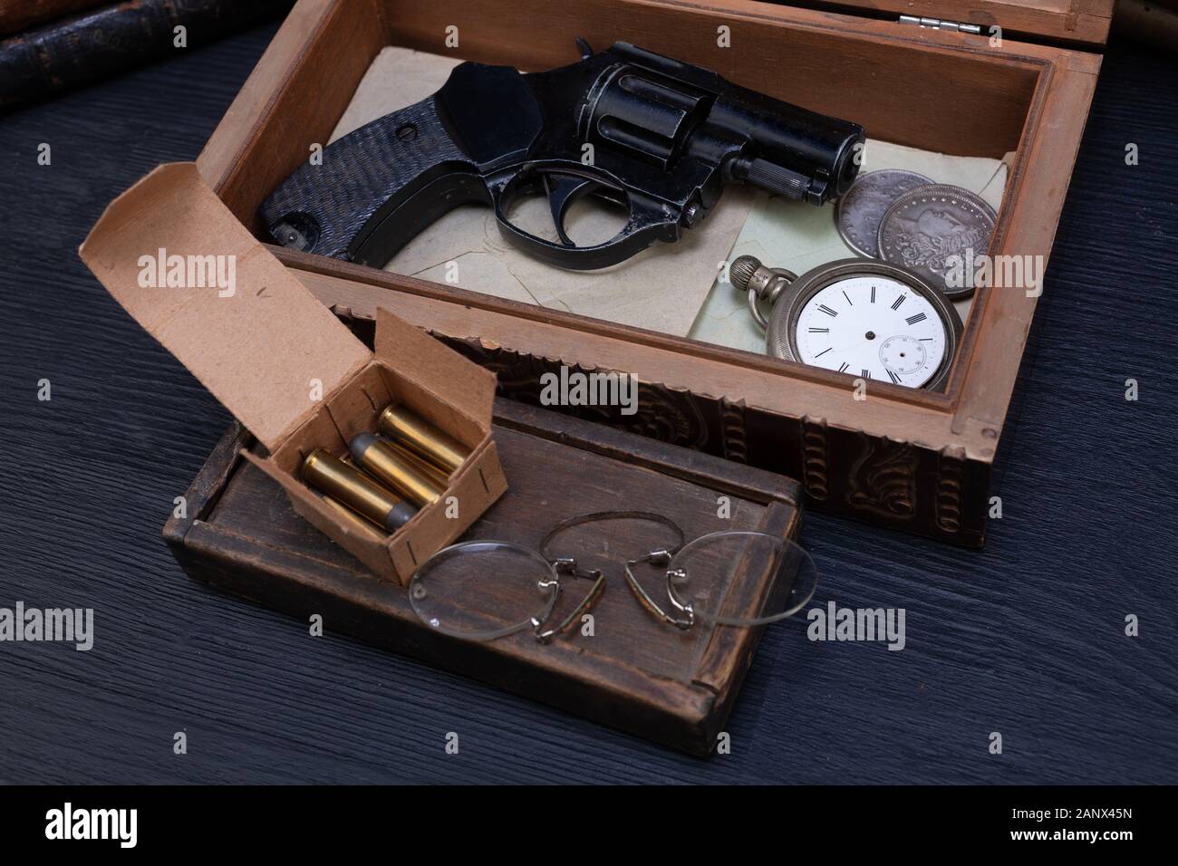 Memorabilia - old retro vintage revolver gun with ammunitions in wooden ...