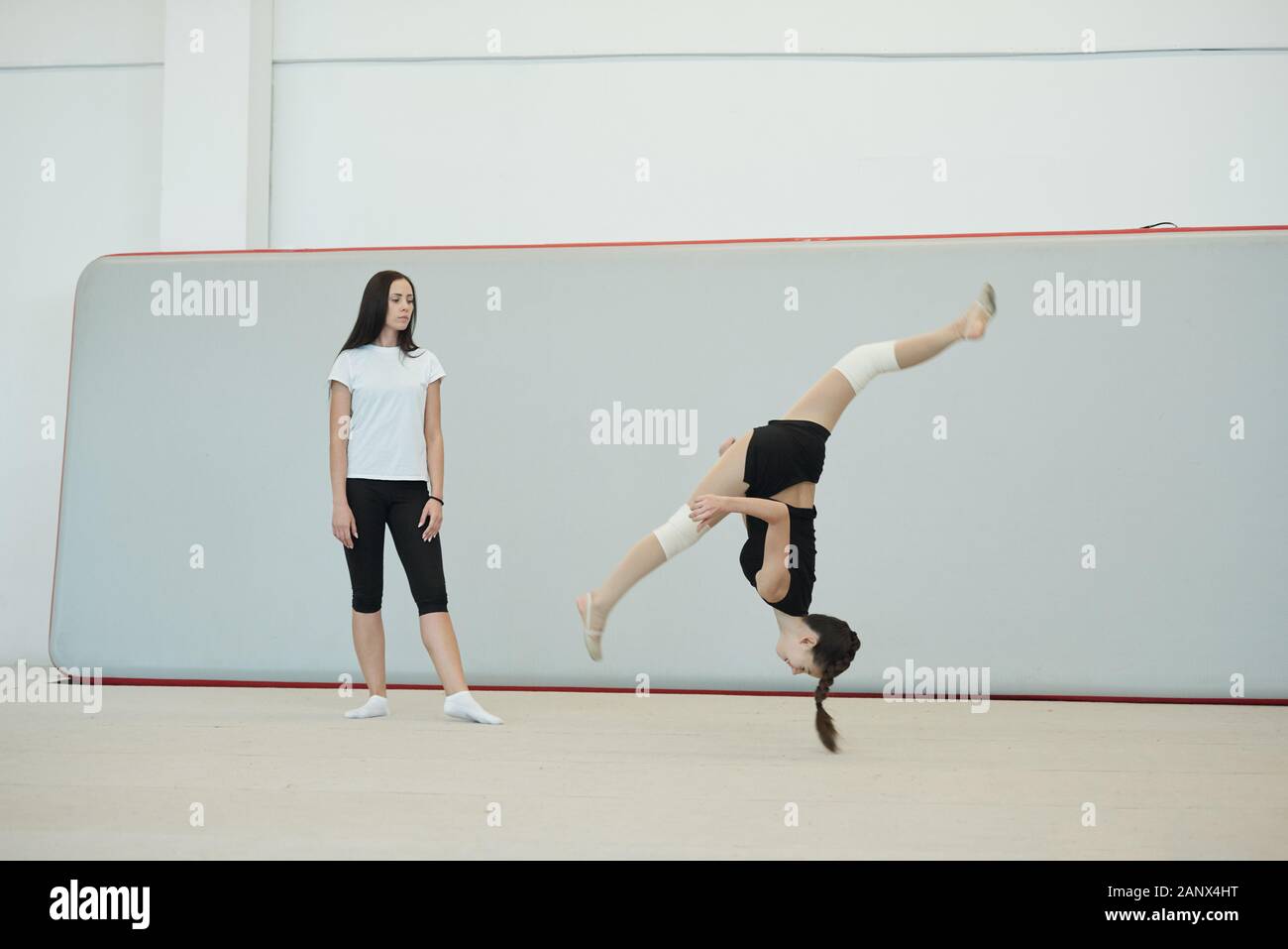 Jumping over head at training Stock Photo - Alamy