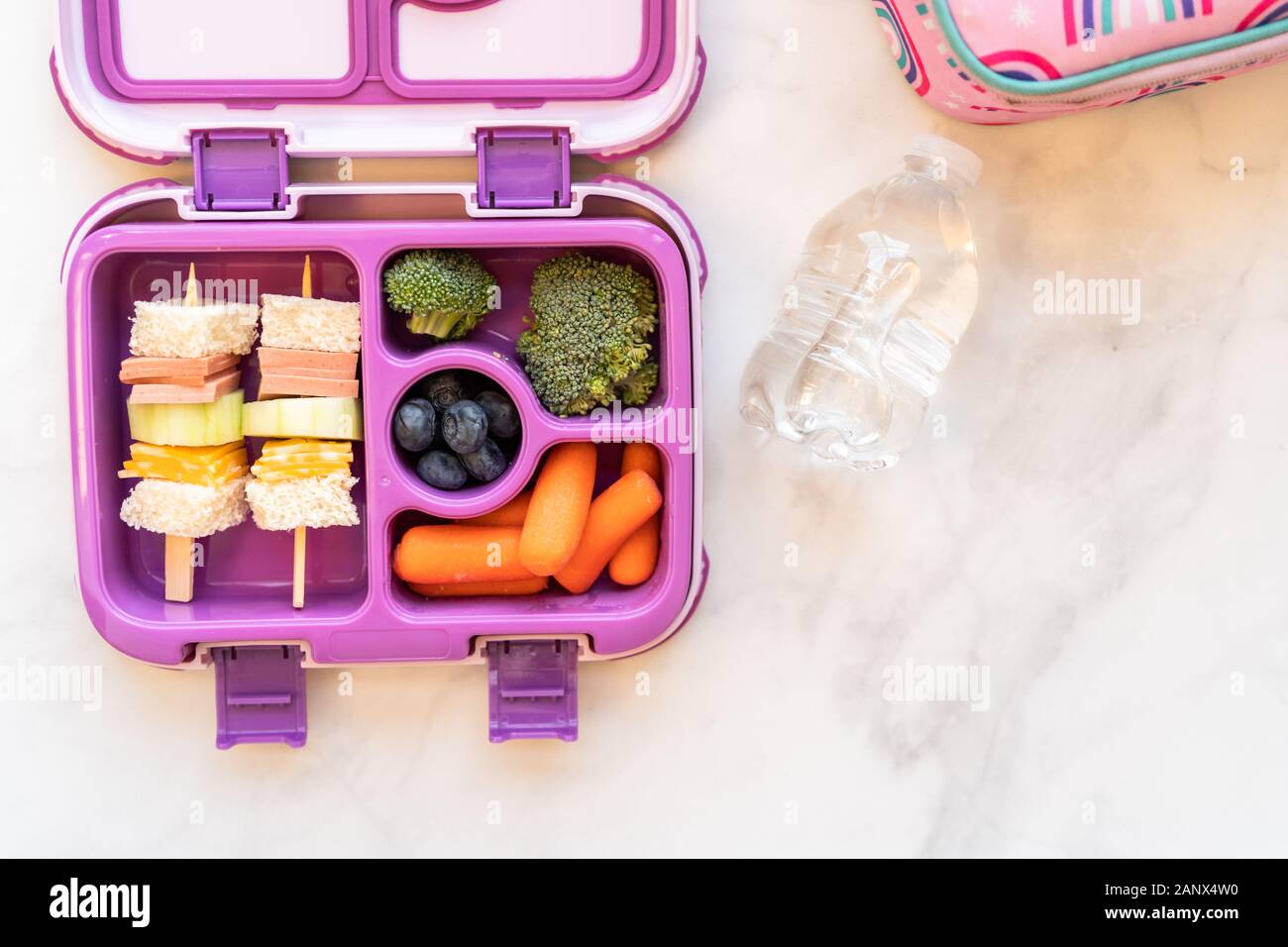 Flat lay. Healthy school lunch with kebab sandwich and vegetables in ...
