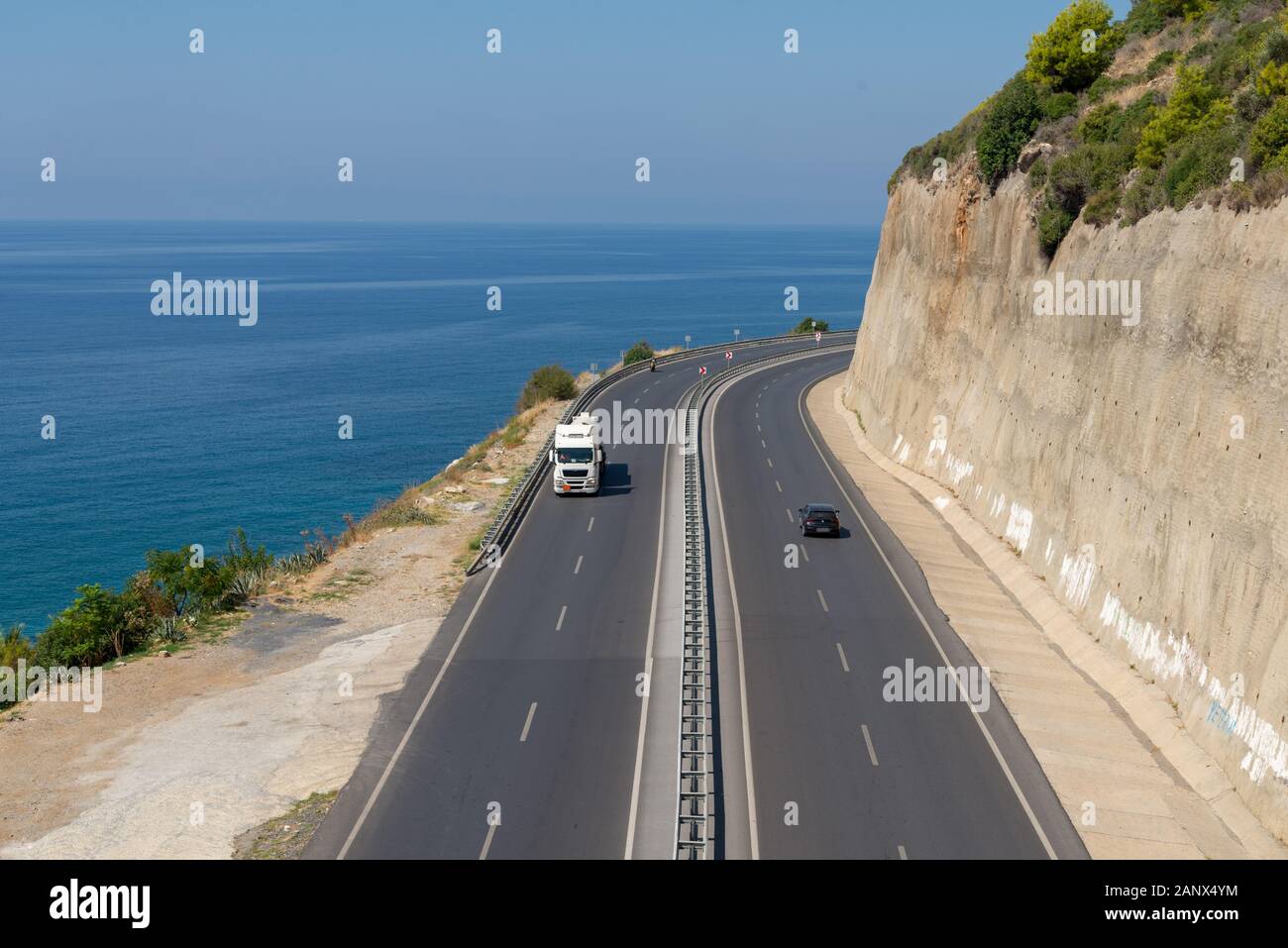 Turkish coastal highway along the sea below the steep cliff Stock Photo ...