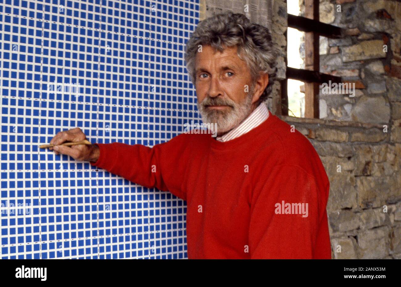 Architect Craig Ellwood painting in his studio at home in Pergine ...