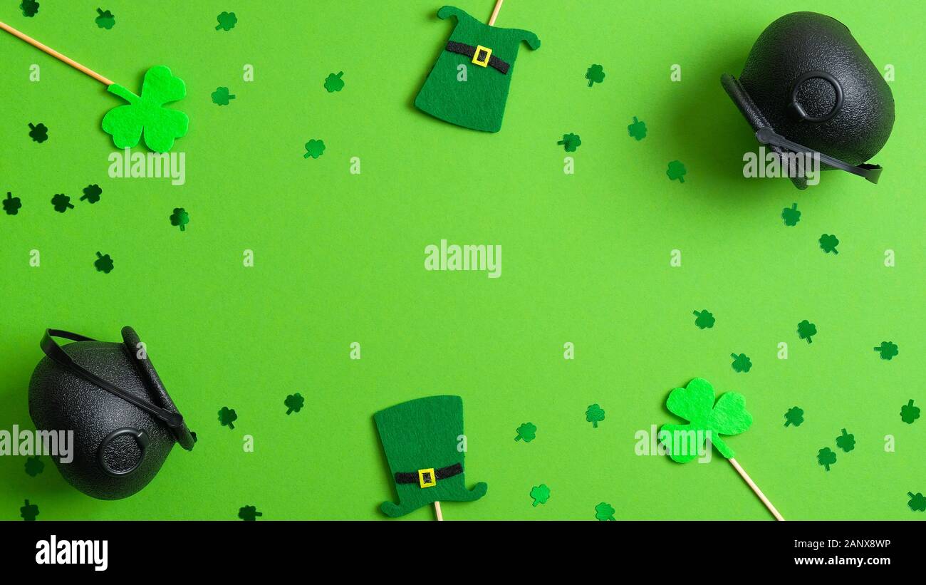 St Patricks Day frame of leprechaun hats, shamrocks, pots of gold and ...